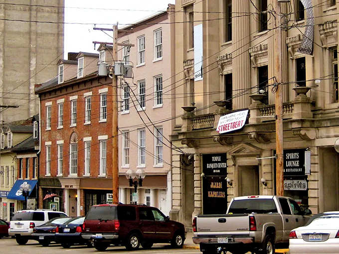 Historic buildings climb the bluffs in layers, creating a vertical neighborhood where every floor offers better river views.