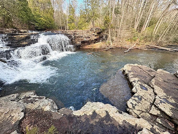 That turquoise pool against dark stone is like finding a hidden oasis, perfect for cooling off after your walk.