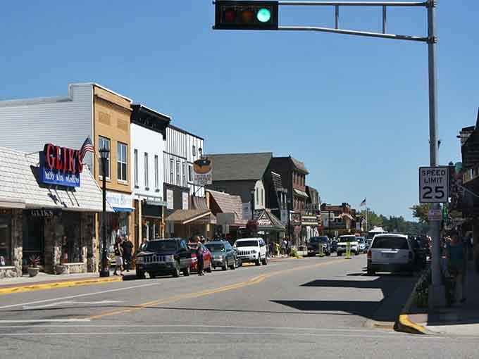 Summer crowds fill streets lined with shops offering everything from antiques to ice cream cones.