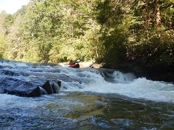 The Green River shows its power as adventurers ride the whitewater through a sun-dappled mountain corridor.