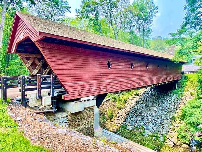 The exposed lattice truss framework and rocky creek below remind you that great engineering can also be genuinely gorgeous to look at.