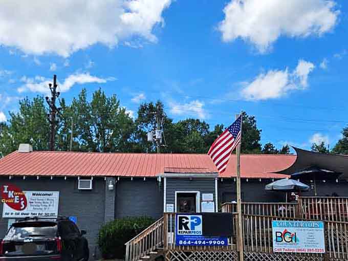 An American flag, a red metal roof, and a warm welcome sign make Ike's feel like a neighborhood institution worth celebrating.