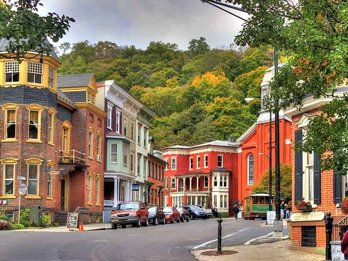 Mountains embrace colorful Victorian buildings in a hug that's lasted over a century and counting.