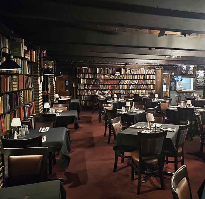 Floor-to-ceiling bookshelves, black tablecloths, and tiny table lamps — dining at Library II feels like eating inside a very delicious novel.