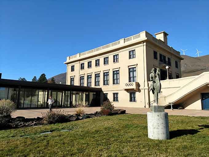 That classical facade stands proud against the rolling hills, proving elegance never goes out of style anywhere.