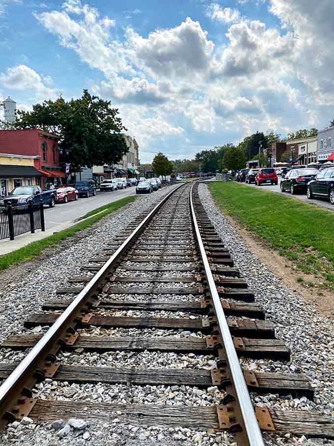 Those steel rails cutting straight through Midway's downtown aren't just tracks, they're the backbone of one of Kentucky's most photogenic little towns.