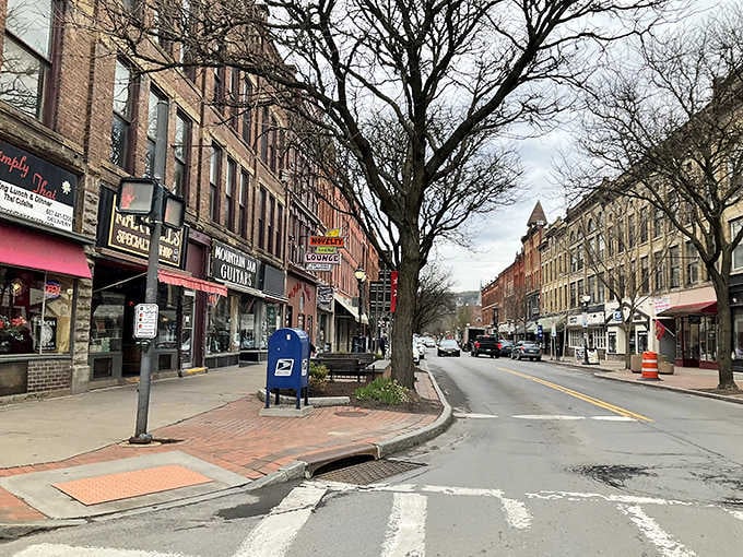 Oneonta's Main Street stretches into the distance with guitar shops and Thai restaurants sharing the same cheerful block.