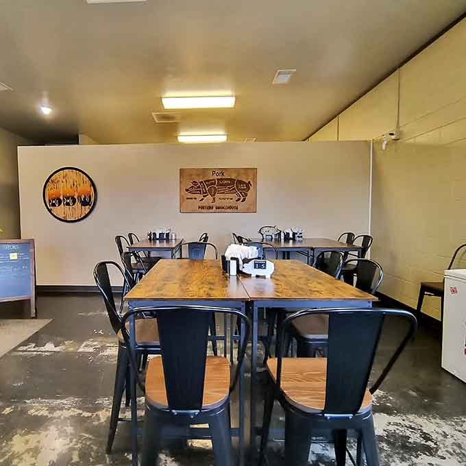 Simple dining room with butcher charts on the wall—no pretense, just honest BBQ served with straightforward Midwest hospitality.