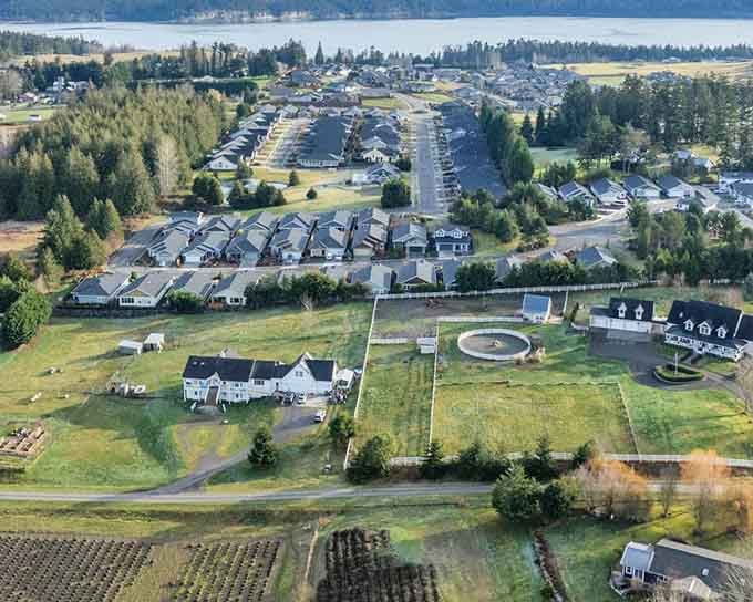 Sequim's rolling fields and waterfront neighborhoods, seen from above, reveal a town that quietly has it all figured out.