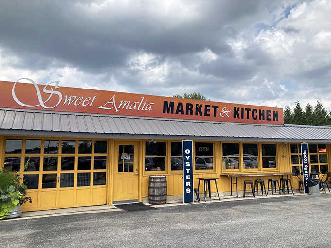 A barrel out front, an oysters sign by the door, and dramatic clouds overhead set the scene for a serious seafood adventure.