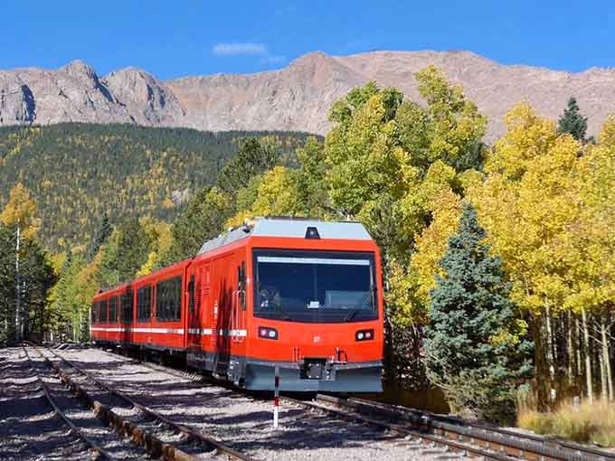 Blazing through golden aspens with Pikes Peak looming behind, this red rocket means serious mountain business.