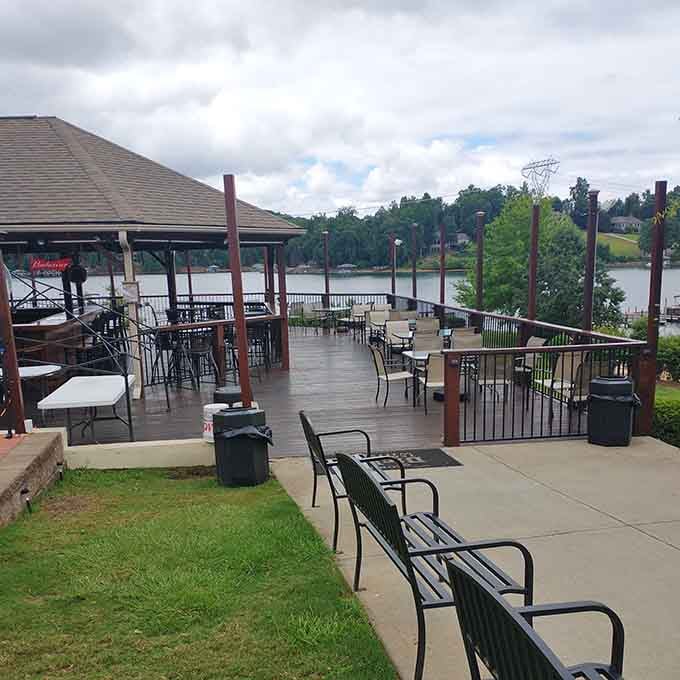 That covered deck overlooking Lake Keowee is where long conversations and cold drinks happen best together.