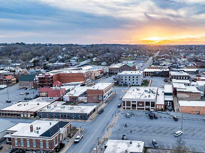 West Plains glows like an ember at sunset, the warm light washing over rooftops and the West Plains Bank sign, reminding you that some towns are worth staying for.