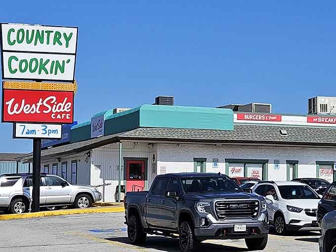 Burgers, breakfast, and that cheerful teal awning trim make this corner spot look like the friendliest place on the whole boulevard.