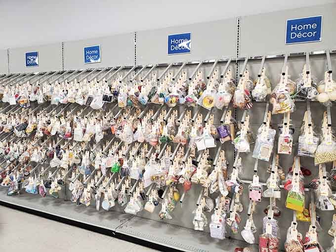 Hundreds of small home decor pieces bundled and hanging in neat rows, like a wall of little surprises just waiting to be unwrapped.
