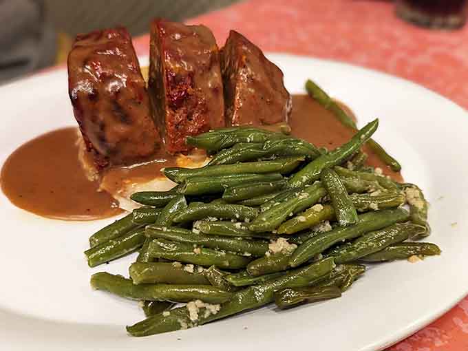 Meatloaf with tomato glaze and green beans. Simple, honest, and somehow better than you remembered it being.