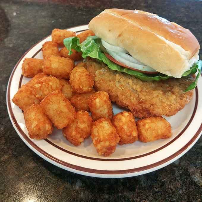 A breaded tenderloin sandwich with tater tots that could make a grown adult genuinely emotional. Ohio does it right.