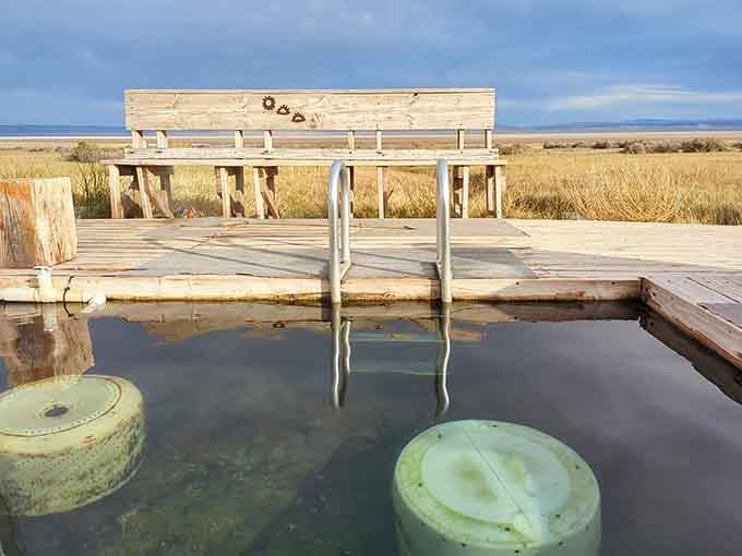 A weathered wooden bench with a front-row seat to the Alvord Desert, no reservation needed.
