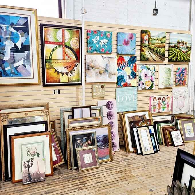 Framed artwork stacked and hung like a mini gallery, where your next conversation piece costs less than dinner out.