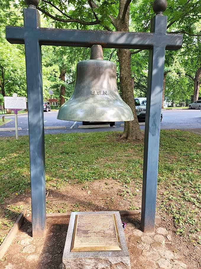 A ship's bell marked U.S.N. standing on dry land, carrying stories that stretch far beyond Kentucky.