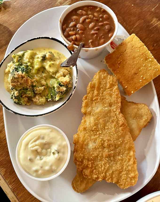 Golden fried cod with broccoli casserole and pinto beans. Simple, honest, and absolutely impossible to leave on the plate.
