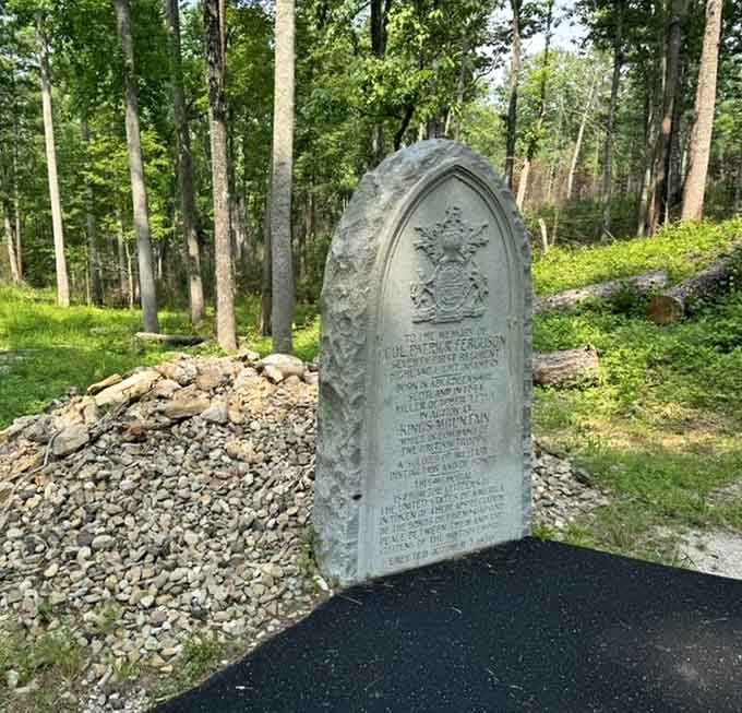 This memorial stone marks a grave that tells its own story, surrounded by rocks that witnessed volcanic fury eons ago.
