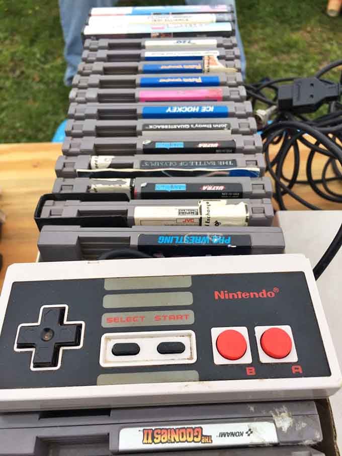 A original Nintendo controller and a stack of cartridges, because childhood nostalgia never goes out of style.
