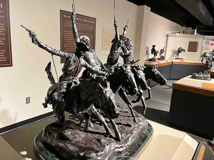 Dynamic bronze riders frozen at full gallop, capturing the raw energy of the American frontier in stunning detail.