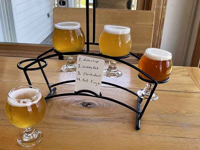 Four beers on a flight rack, each one a small adventure. Rattletrap, Wobbly Pot, Clocked Out, Bell Ringer. Choose wisely.