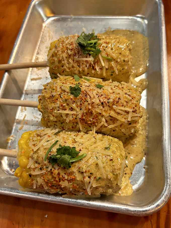 Street corn dressed up with cheese, spices, and cilantro. Even the side dishes here have serious frontier ambition.