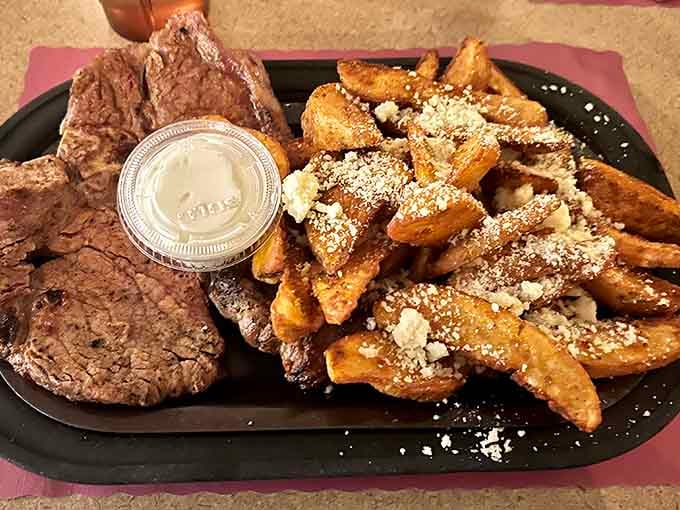 Grilled steak alongside golden roasted potato wedges, simple, honest, and absolutely impossible to argue with.