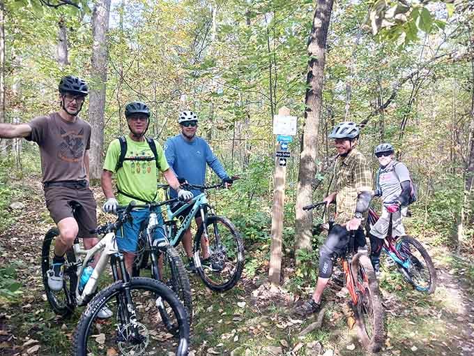 Five mountain bikers, one forest, and the kind of smiles that only come from a really good trail.