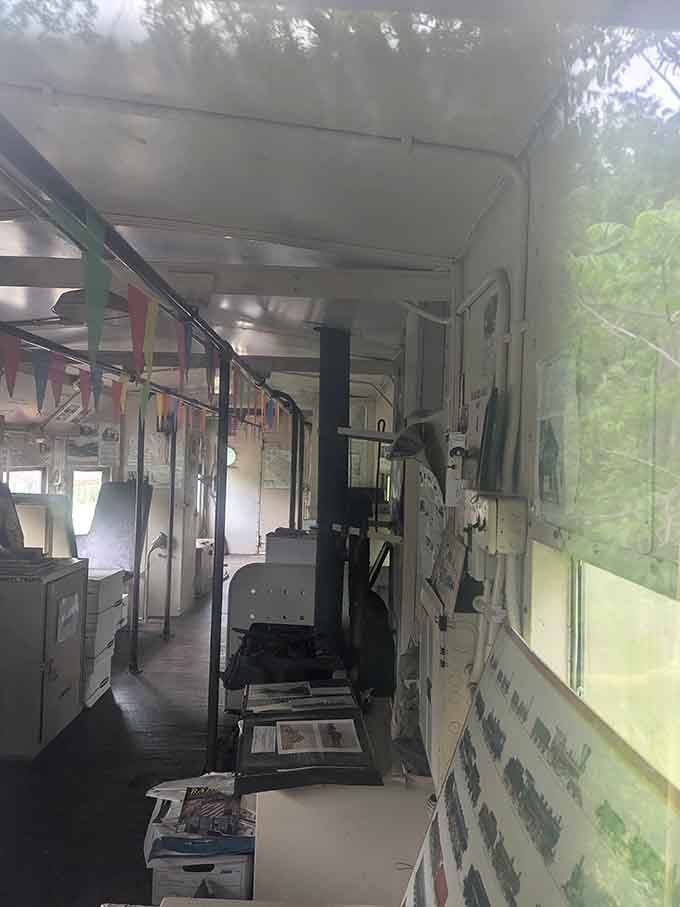 Inside the caboose, colorful pennant flags and old railroad materials tell a story worth slowing down for.