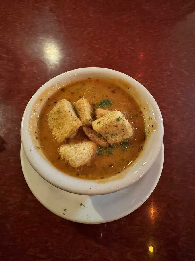 Rich, deep, and topped with croutons. This tomato soup is the kind of bowl that fixes a bad day.