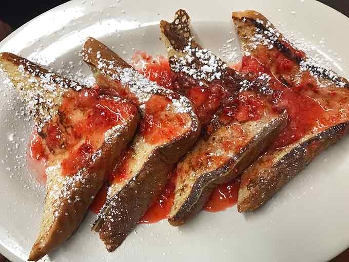 French toast dusted with powdered sugar and topped with strawberries, because some mornings deserve to feel like a celebration.