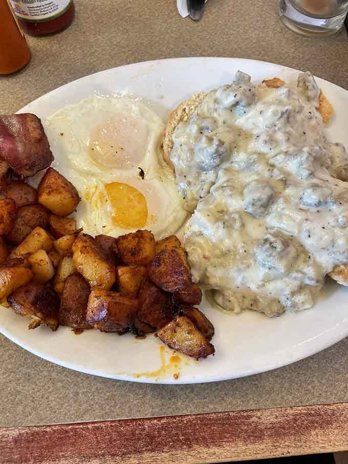 Biscuits drowning in gravy next to a sunny-side-up egg is the kind of comfort food that fixes bad days.