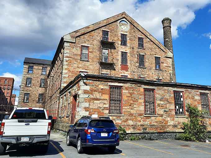 The old stone mill building outside looks like it belongs in a history book. Spoiler: the inside is even better.