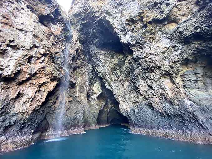 Paddling into these ancient sea caves feels like discovering your own private cathedral carved by waves.