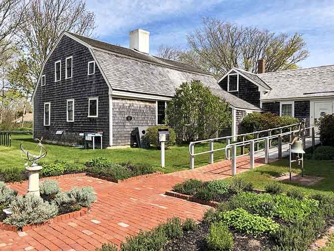 The Atwood Museum complex sits behind a brick garden path, looking like a place where history actually wants to be found.