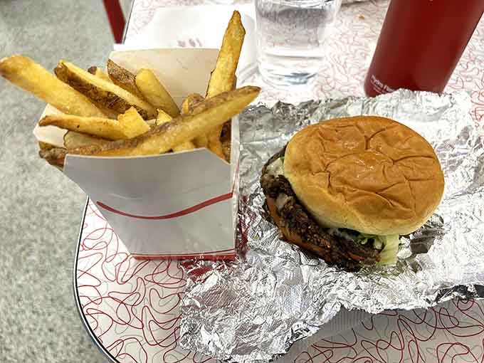 A proper burger and a box of golden fries. Simple, honest, and completely impossible to eat without smiling.