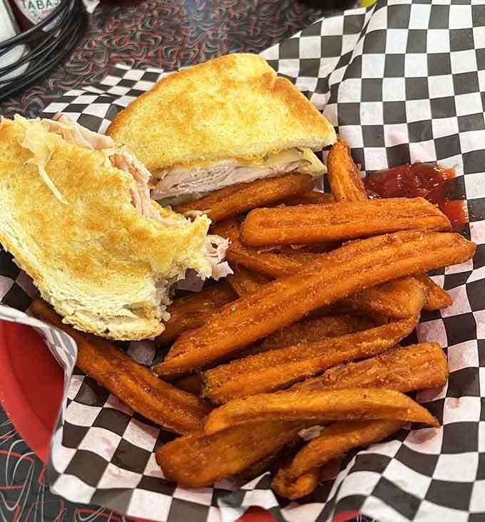 A turkey sandwich with sweet potato fries on the side, simple, satisfying, and absolutely worth the trip.