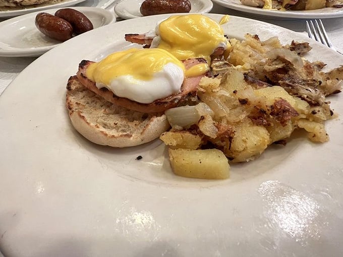 Eggs Benedict done right, with a Hollandaise so glossy it practically winks at you from the plate.