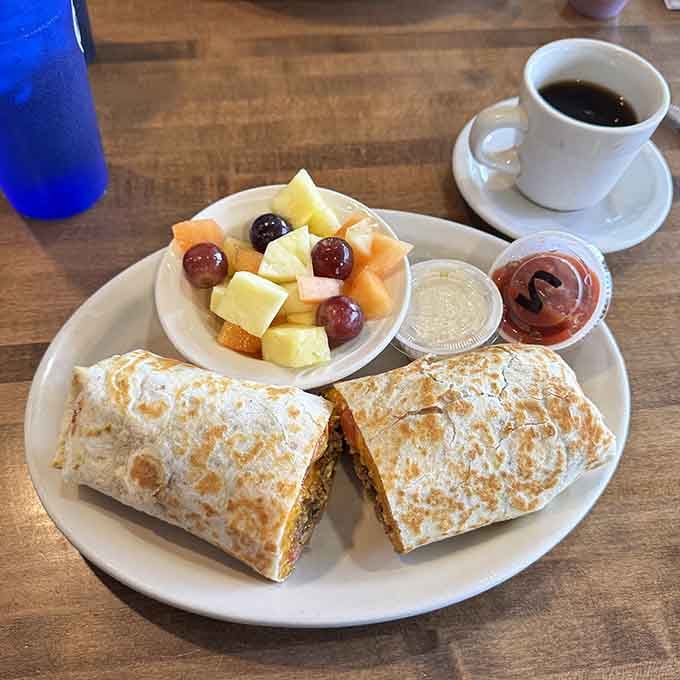 A toasty breakfast burrito with fresh fruit on the side, because balance is a beautiful thing.