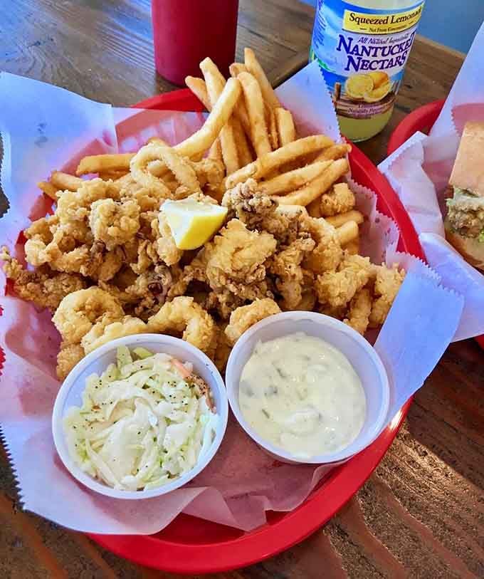 Golden fried calamari with tartar sauce and coleslaw, the kind of basket that makes you forget about counting calories.