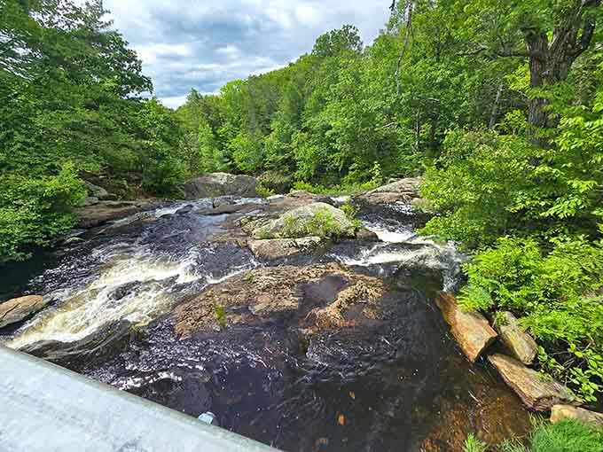 The river flows over ancient bedrock, creating pools that look almost too blue to be real.