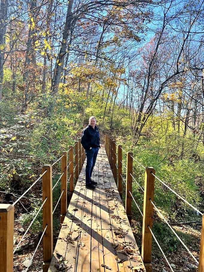 Standing on a wooden bridge surrounded by fall color is the kind of moment that makes your phone camera feel inadequate.