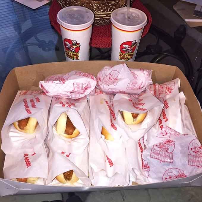 A whole box of wrapped coneys and two cold drinks, someone planned ahead and made very good decisions today.