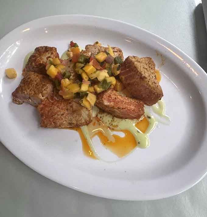 Seared tuna with mango salsa drizzled on top. Simple ingredients, serious flavor, zero complaints from anyone at the table.