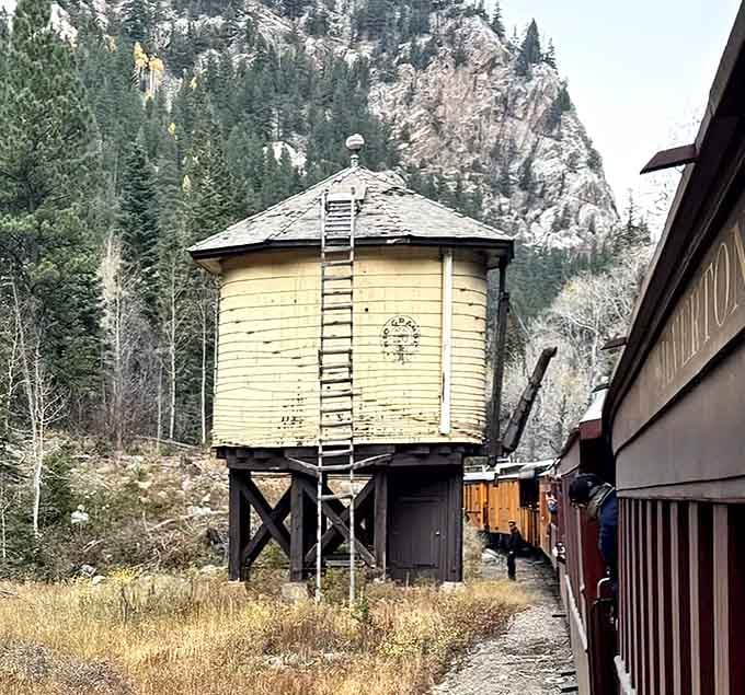 A vintage water tower stands sentinel along the route, a quiet reminder of railroading's hardworking past.