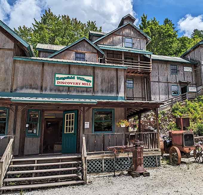 Weathered wood, teal trim, and a rusty tractor out front. The Discovery Mill means business, charming business.